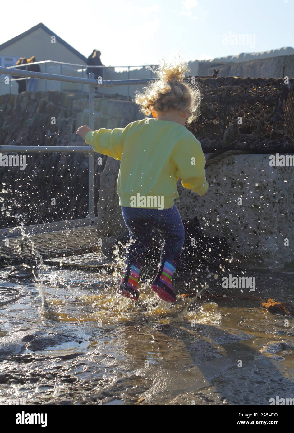 Kid in puddle hi-res stock photography and images - Alamy