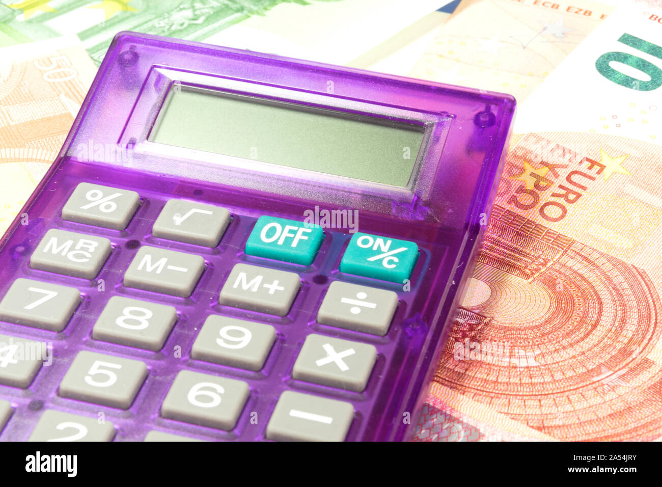 Euro bills and a calculator Stock Photo - Alamy