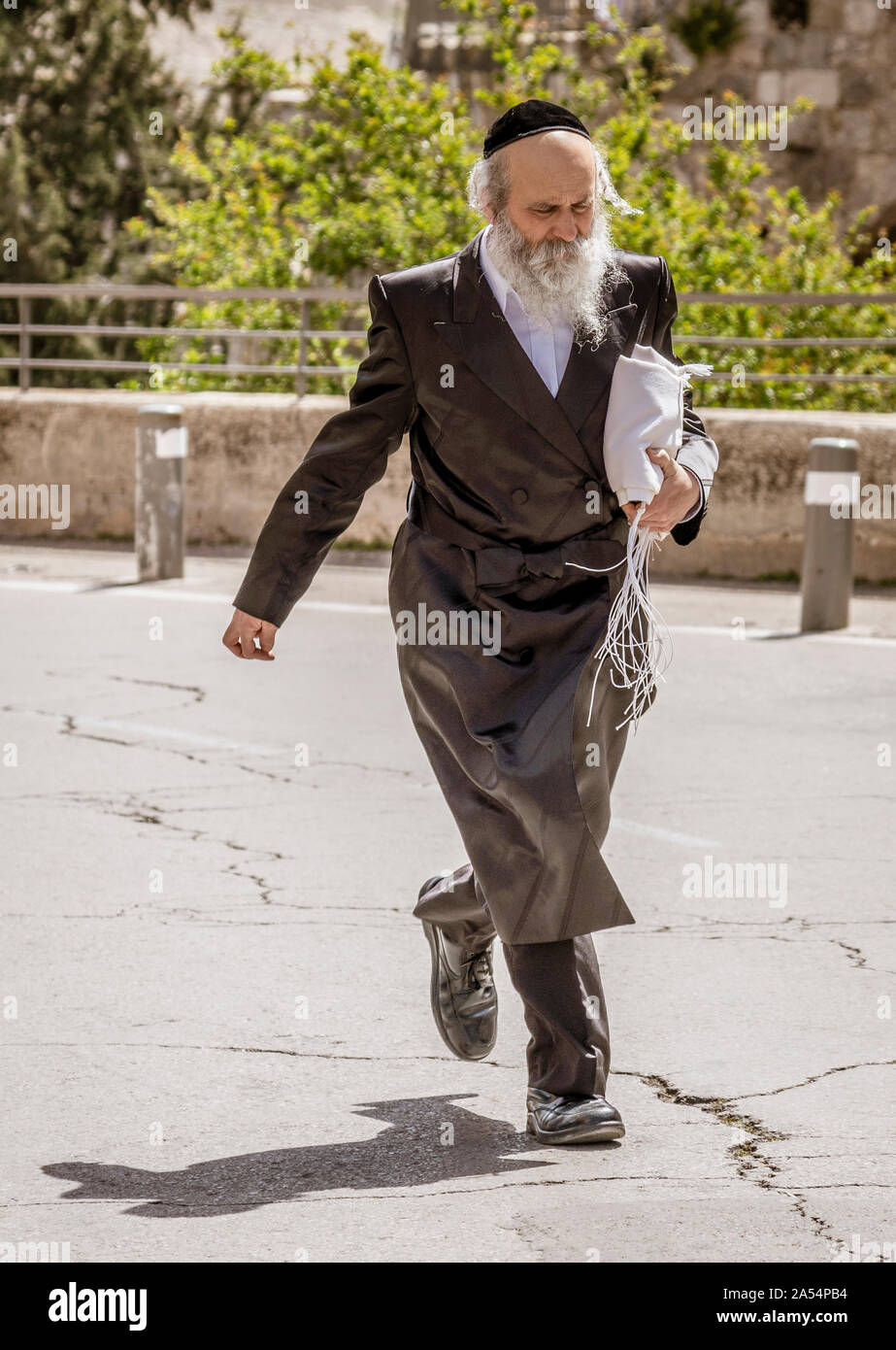 Jerusalem, Israel - 2019-04-26 - orthodox Jew walks across courtyard ...