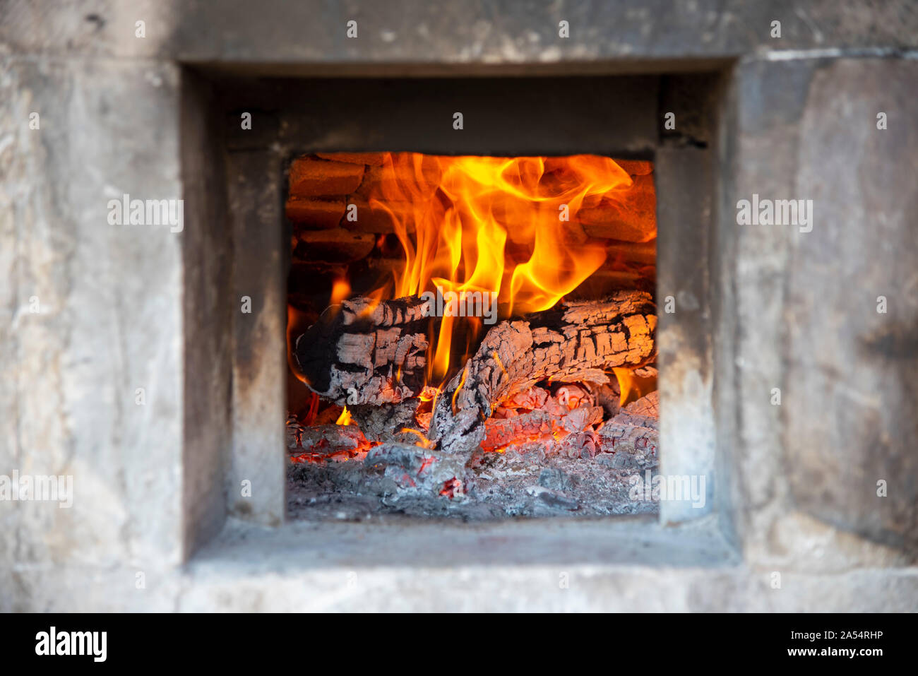 The firebox of the stove in which burns a fire Stock Photo - Alamy