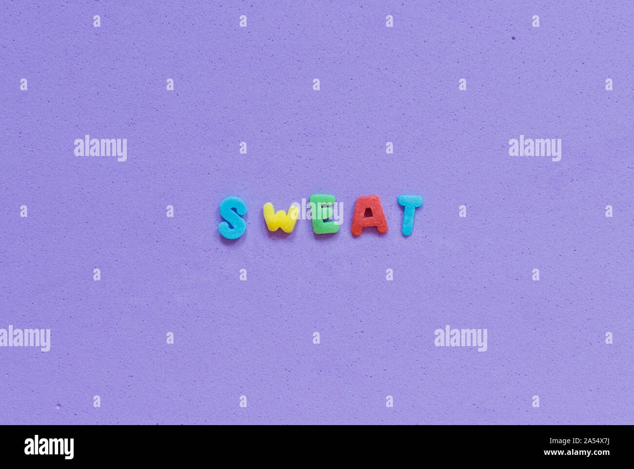 Colorful word Sweet on a bright purple background Stock Photo - Alamy