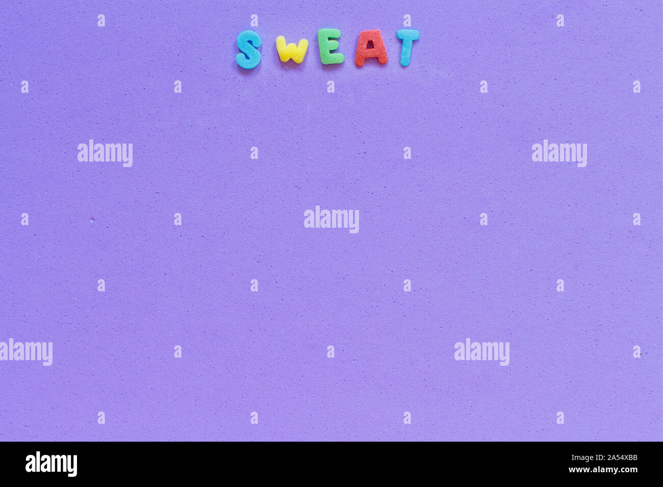 Colorful word Sweet on a bright purple background Stock Photo - Alamy