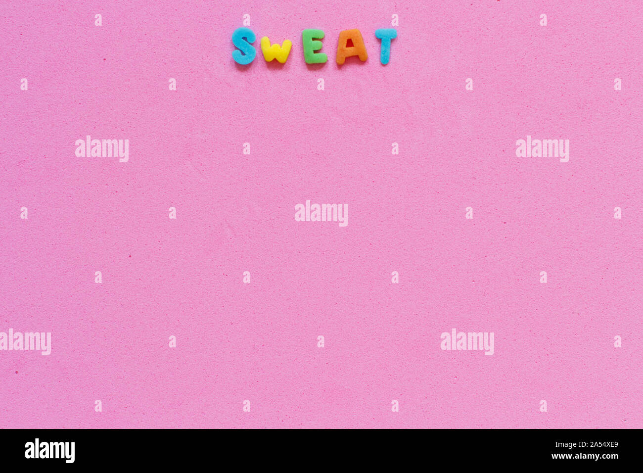 Colorful word Sweet on a bright pink background Stock Photo - Alamy