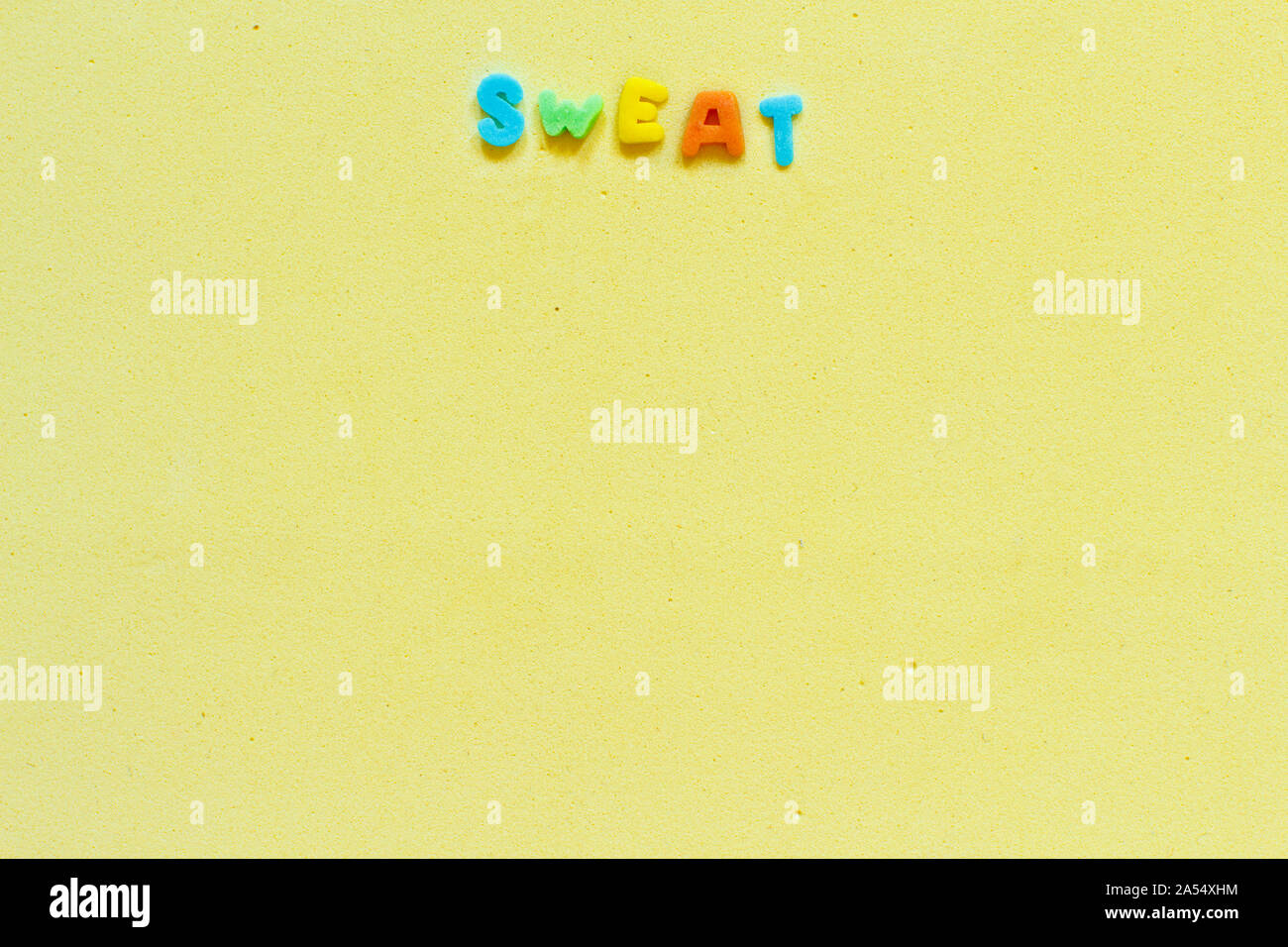 Colorful word Sweet on a bright yellow background Stock Photo - Alamy