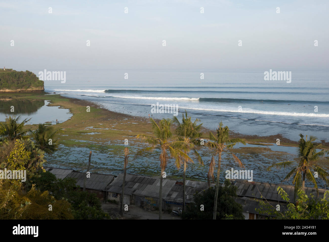 Surfing waves at Balangan beach, Bali, Indonesia Stock Photo - Alamy