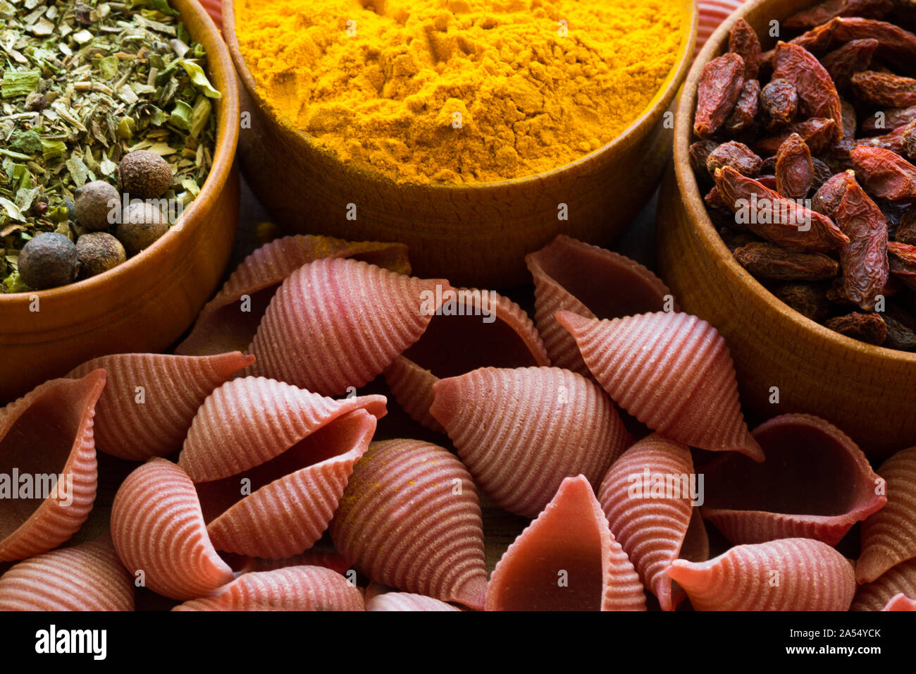 Red pasta with spices and goji berry Stock Photo - Alamy