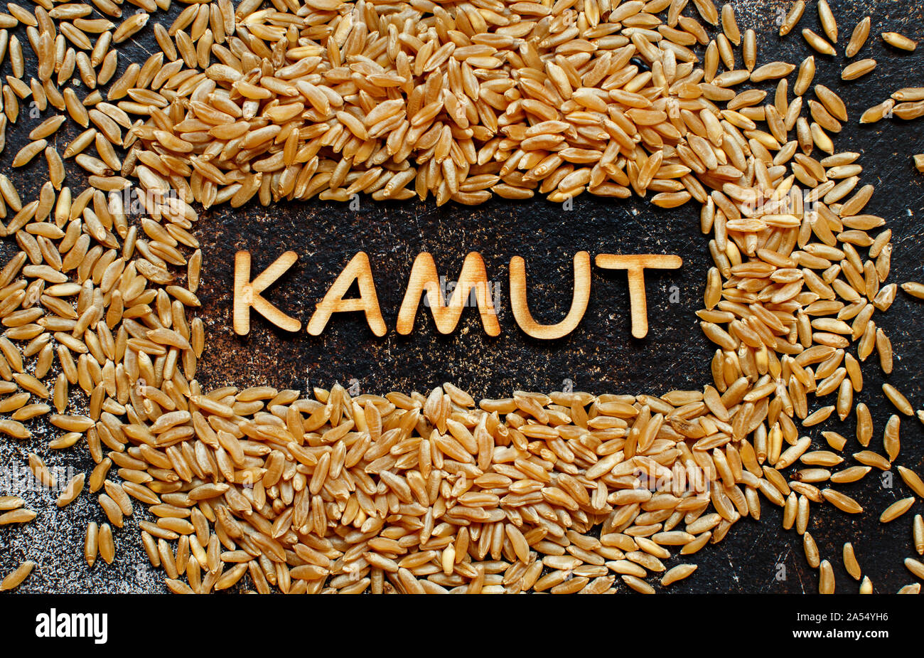 Raw Kamut grain with a word Kamut top view Stock Photo - Alamy