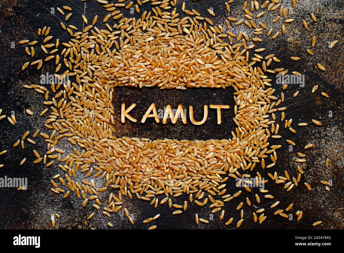 Raw Kamut grain with a word Kamut top view Stock Photo - Alamy
