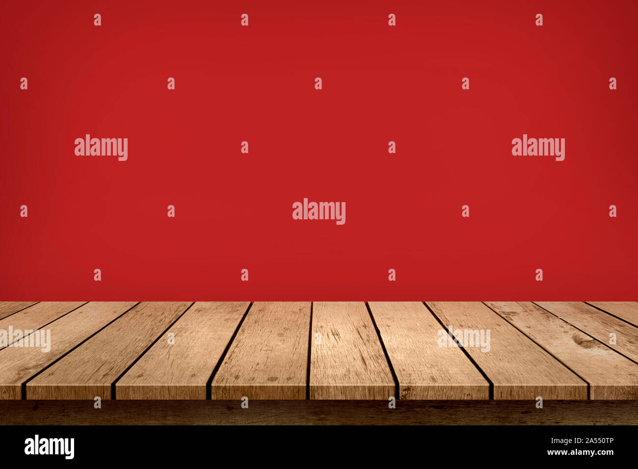 Empty wooden table top on pastel red colour background. Used for ...
