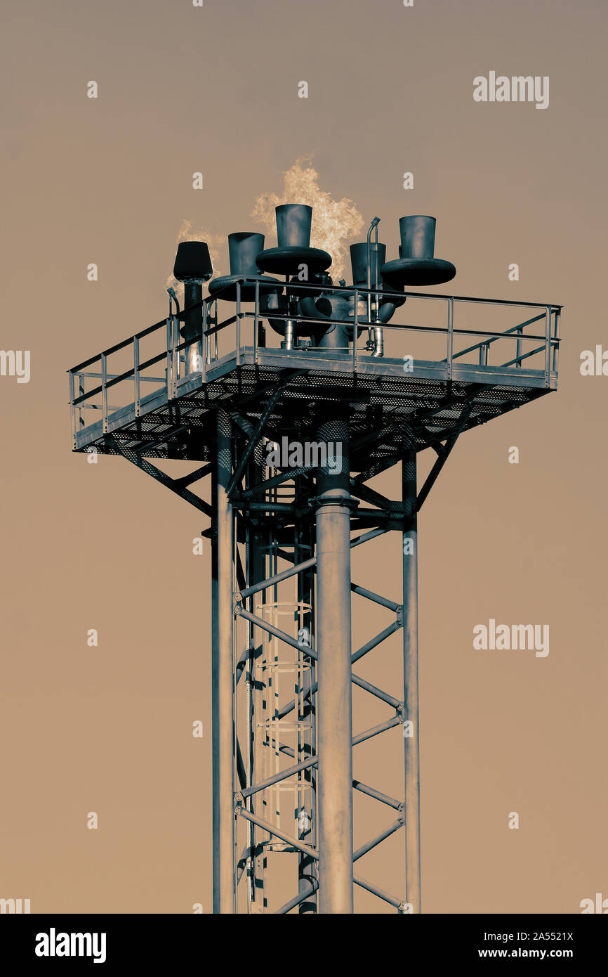 Tower at a natural gas storage facility with flames coming out of the ...