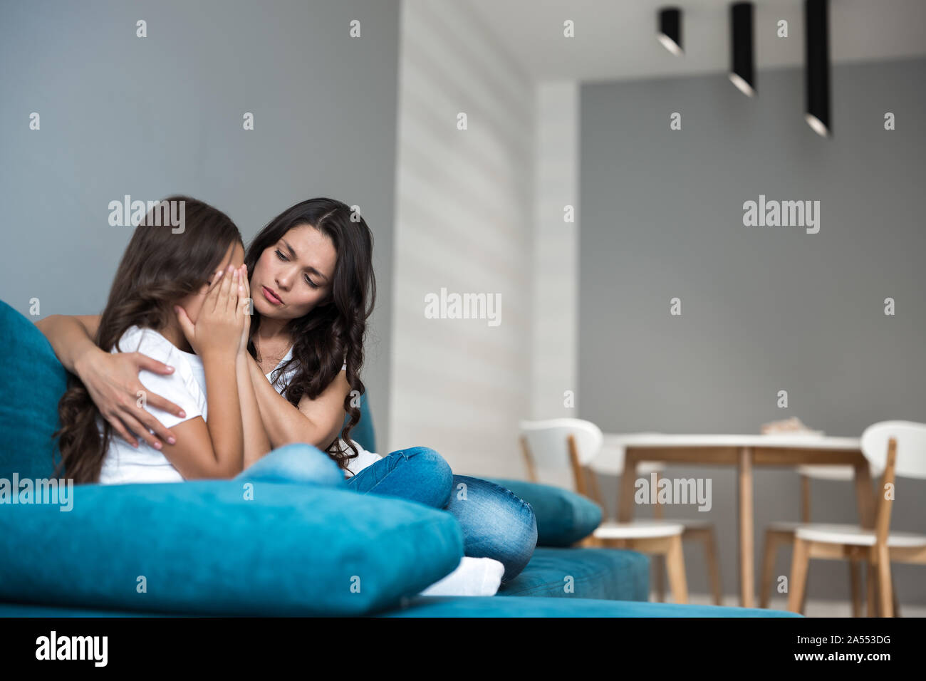 beautiful young mother supporting feeling pitty for her cute teen ...