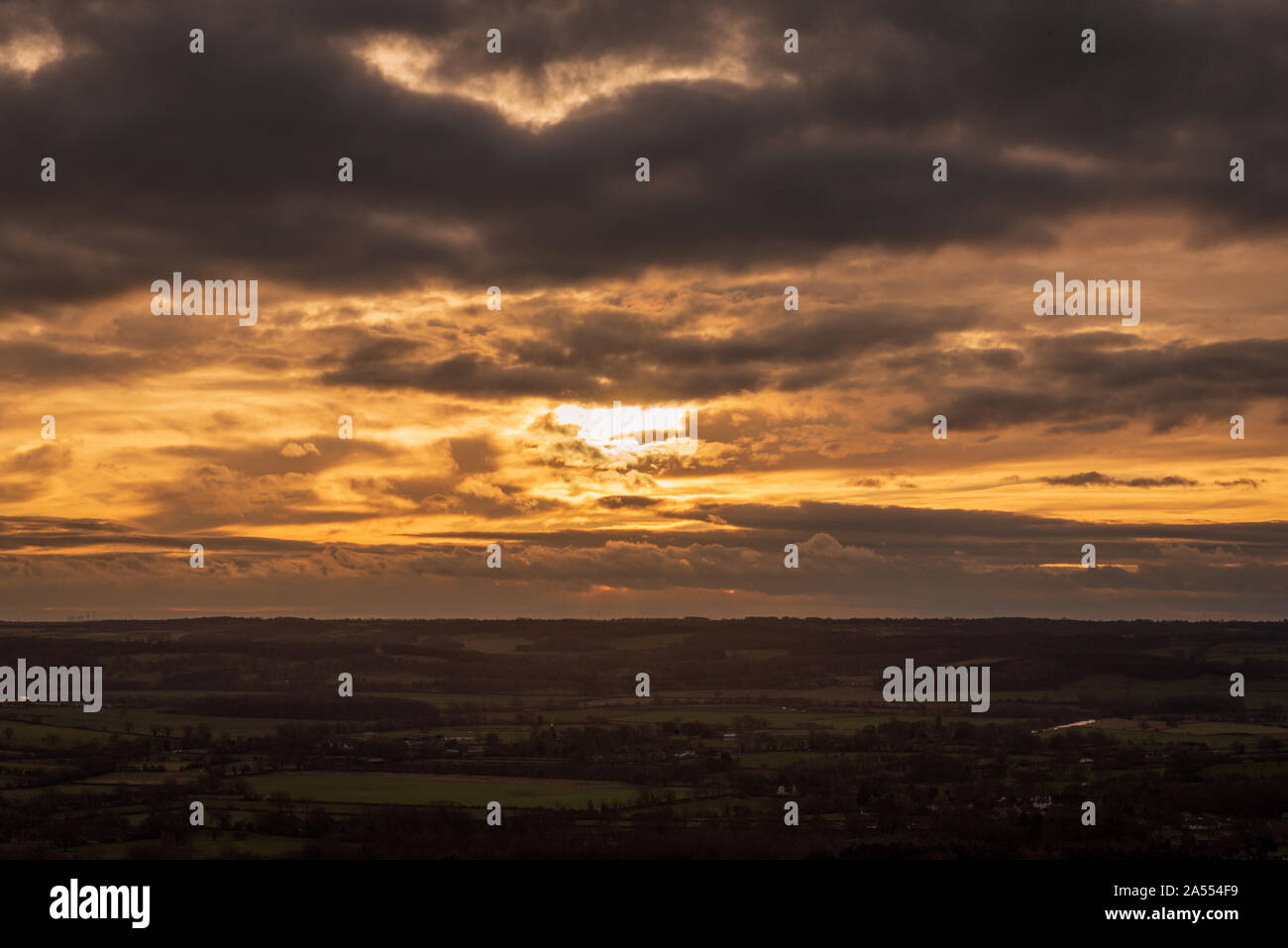 Farm fields at sunset Stock Photo - Alamy