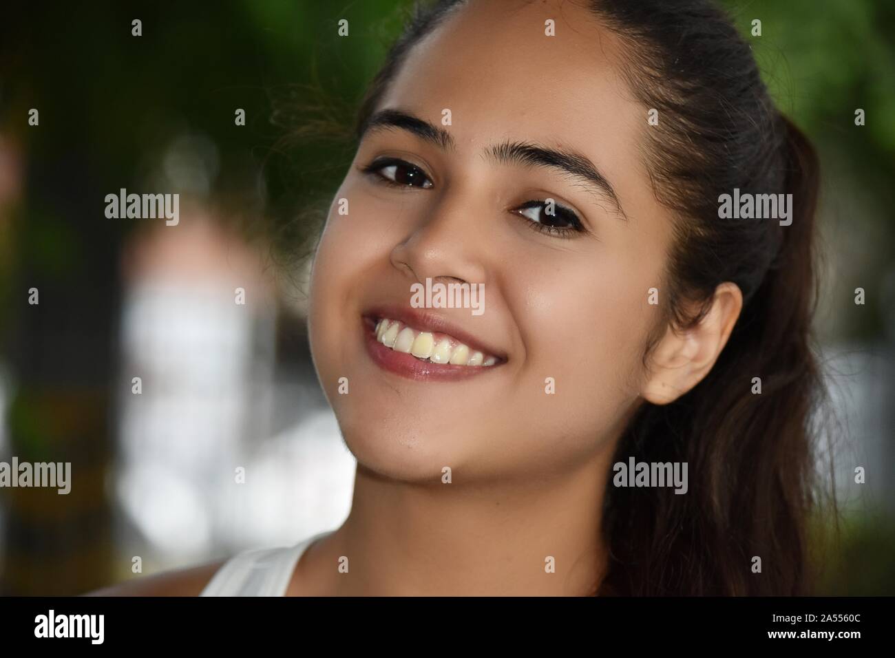 Cute Colombian Female Youngster Smiling Stock Photo - Alamy