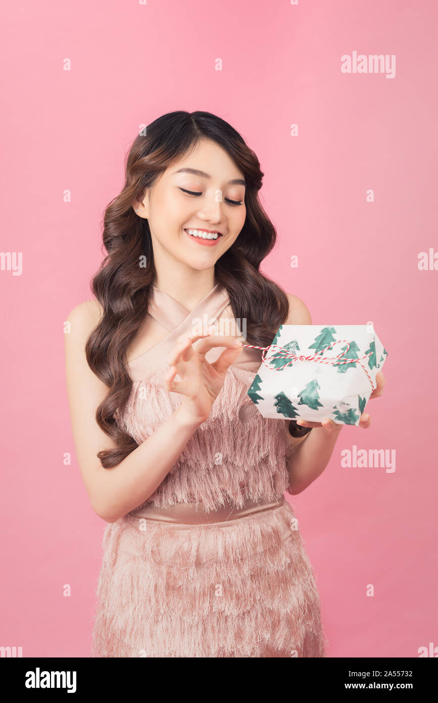 beautiful young asian woman holding present Stock Photo - Alamy