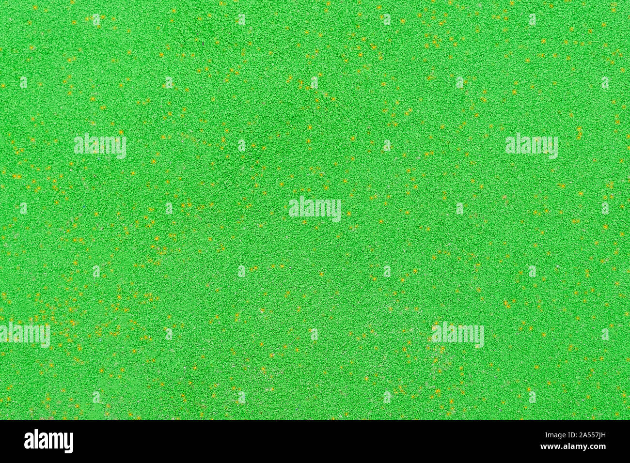 Bright green rubber crumb coating. Soft background made of anti ...