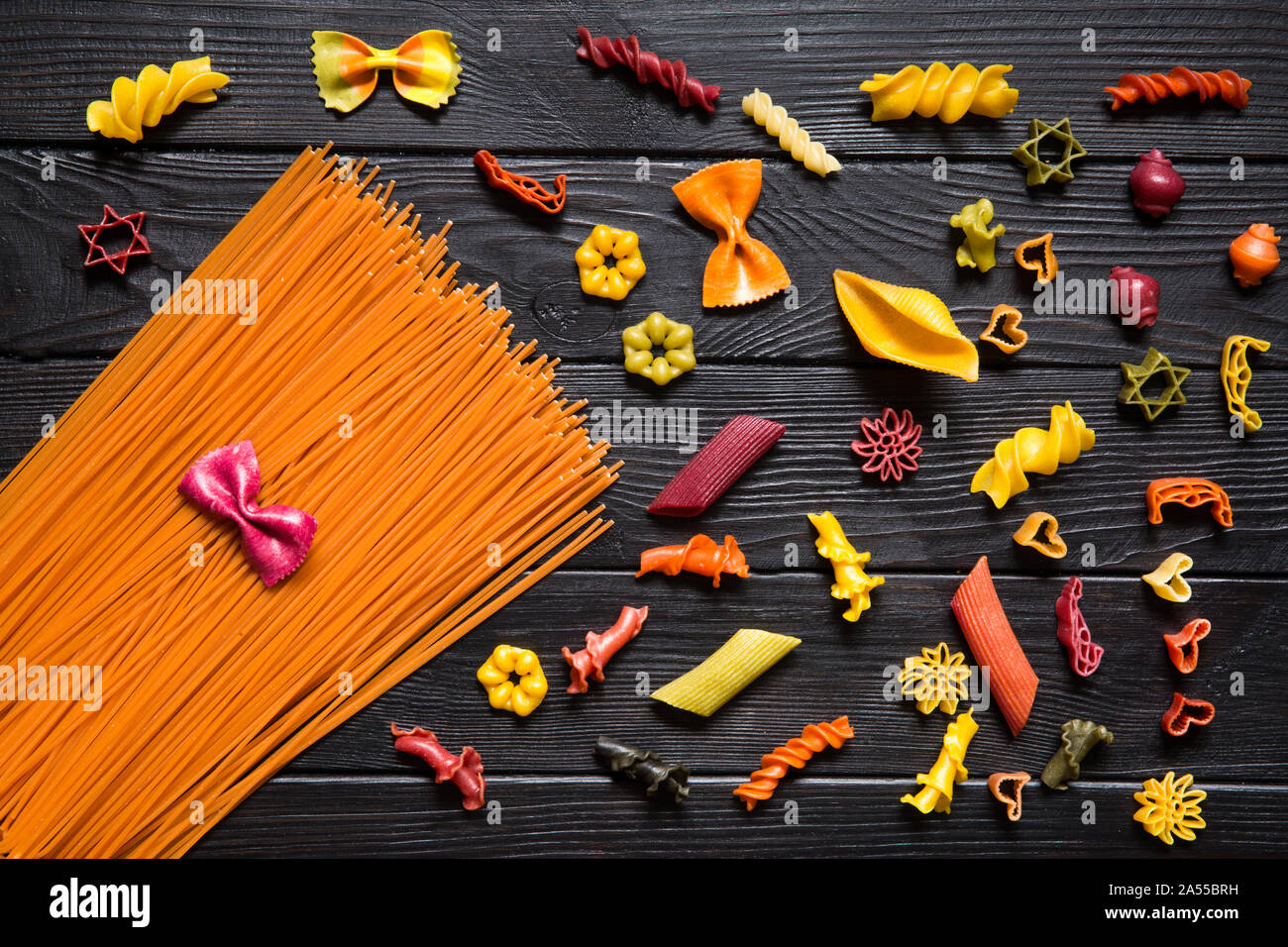 Assortment of pasta. Different kinds of macaroni. Colorful, red, green ...
