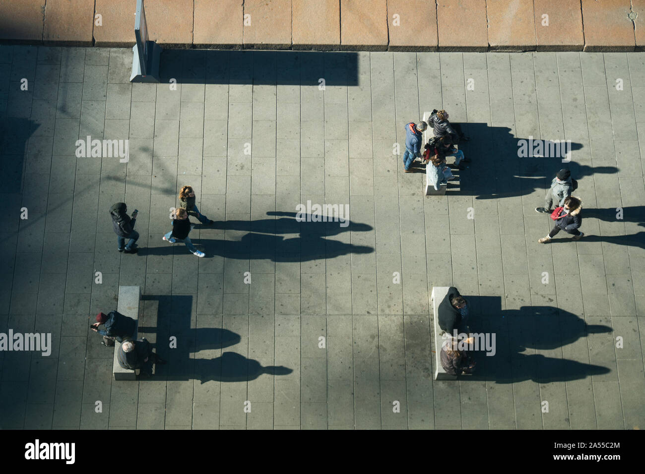 People with big shadows from above Stock Photo - Alamy