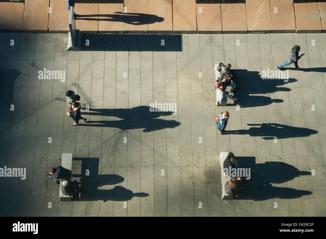 People with big shadows from above Stock Photo - Alamy