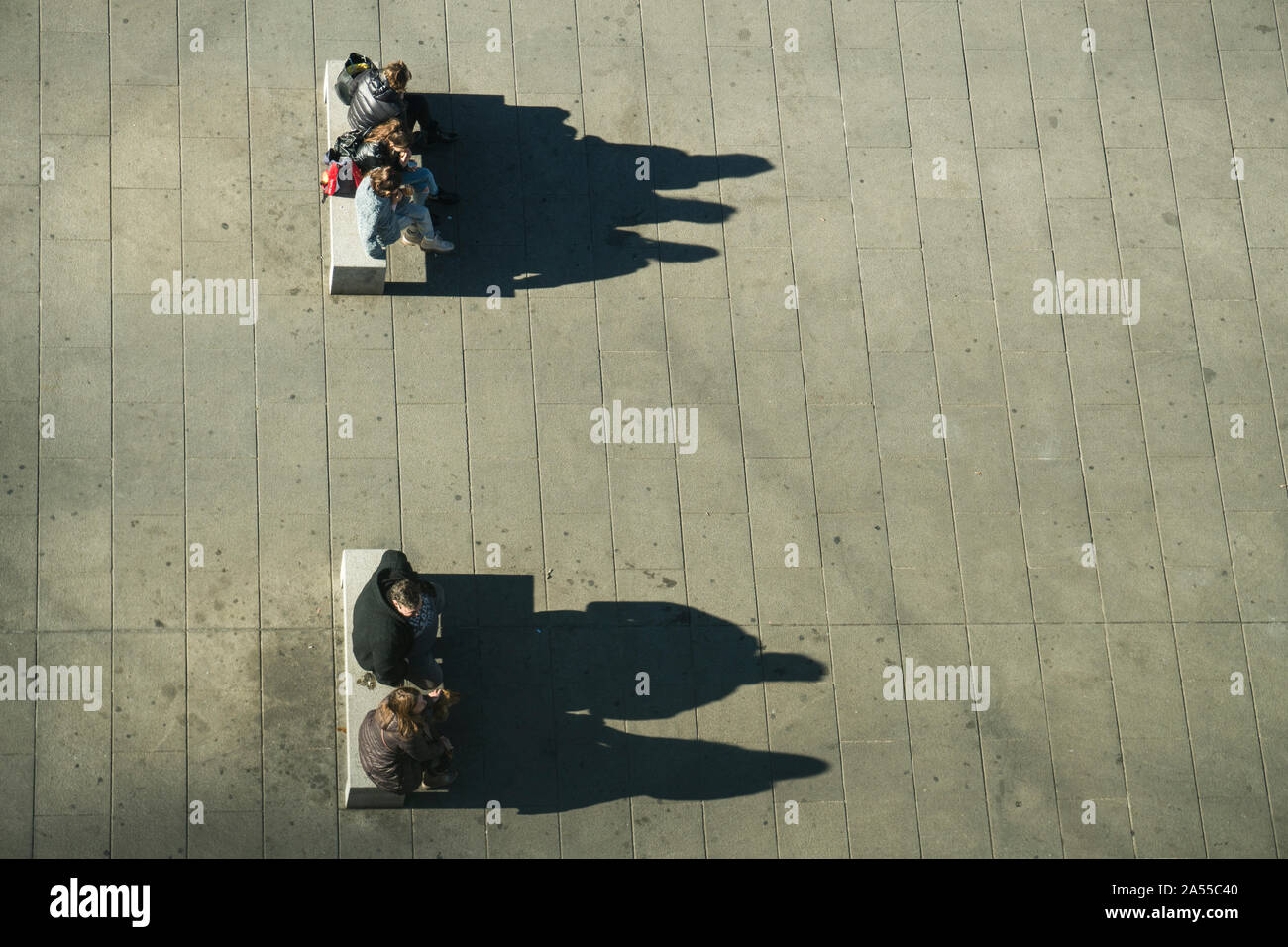 People with big shadows from above Stock Photo - Alamy
