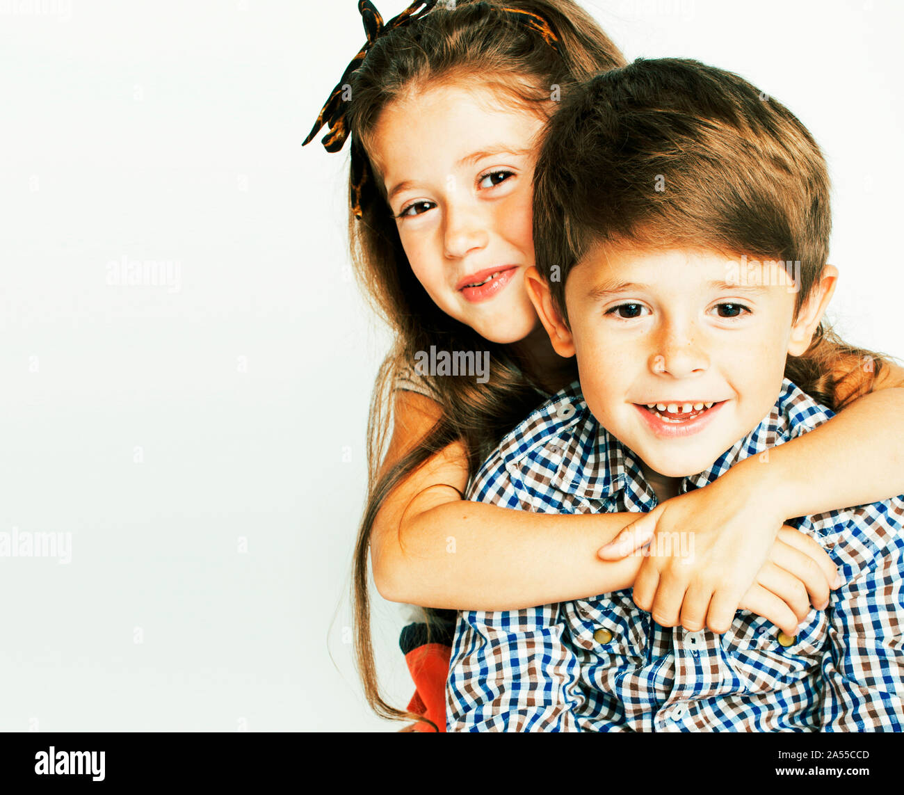 little cute boy and girl hugging playing on white background, happy smiling family, lifestyle ...