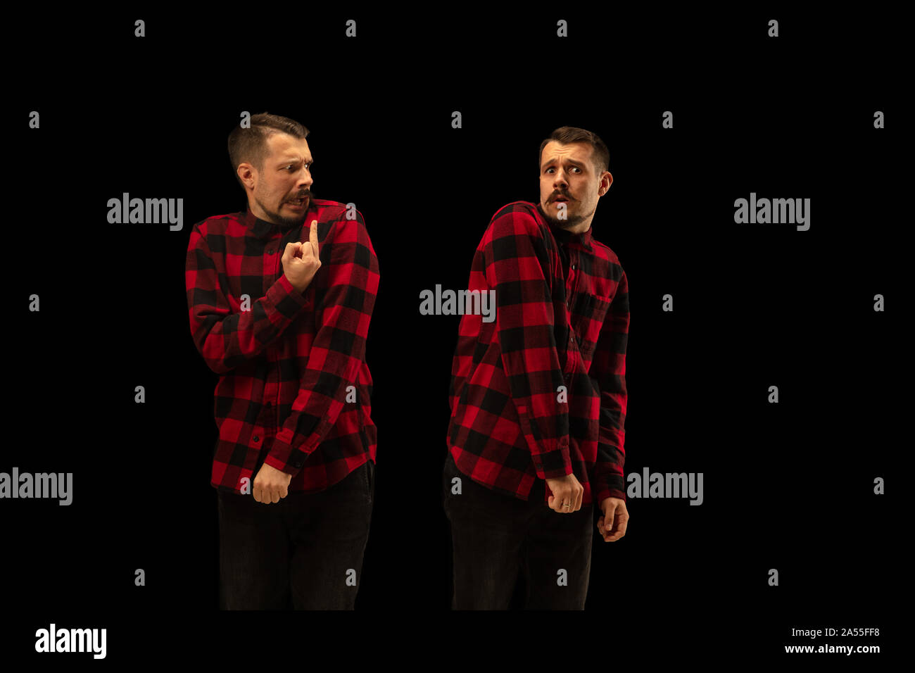 Young handsome man arguing with himself on black studio background ...