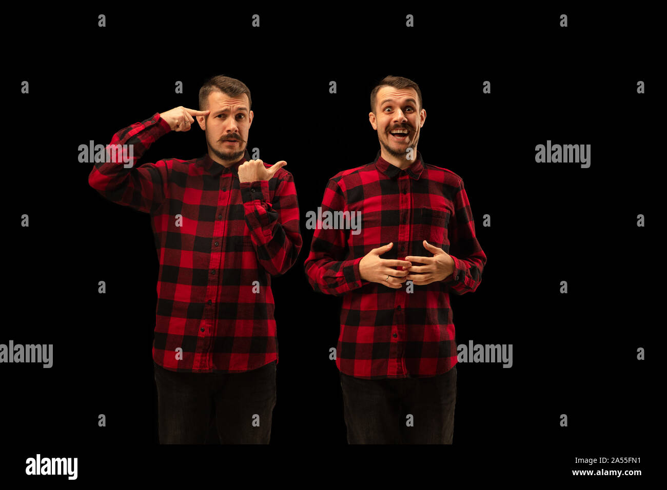 Young handsome man arguing with himself on black studio background ...