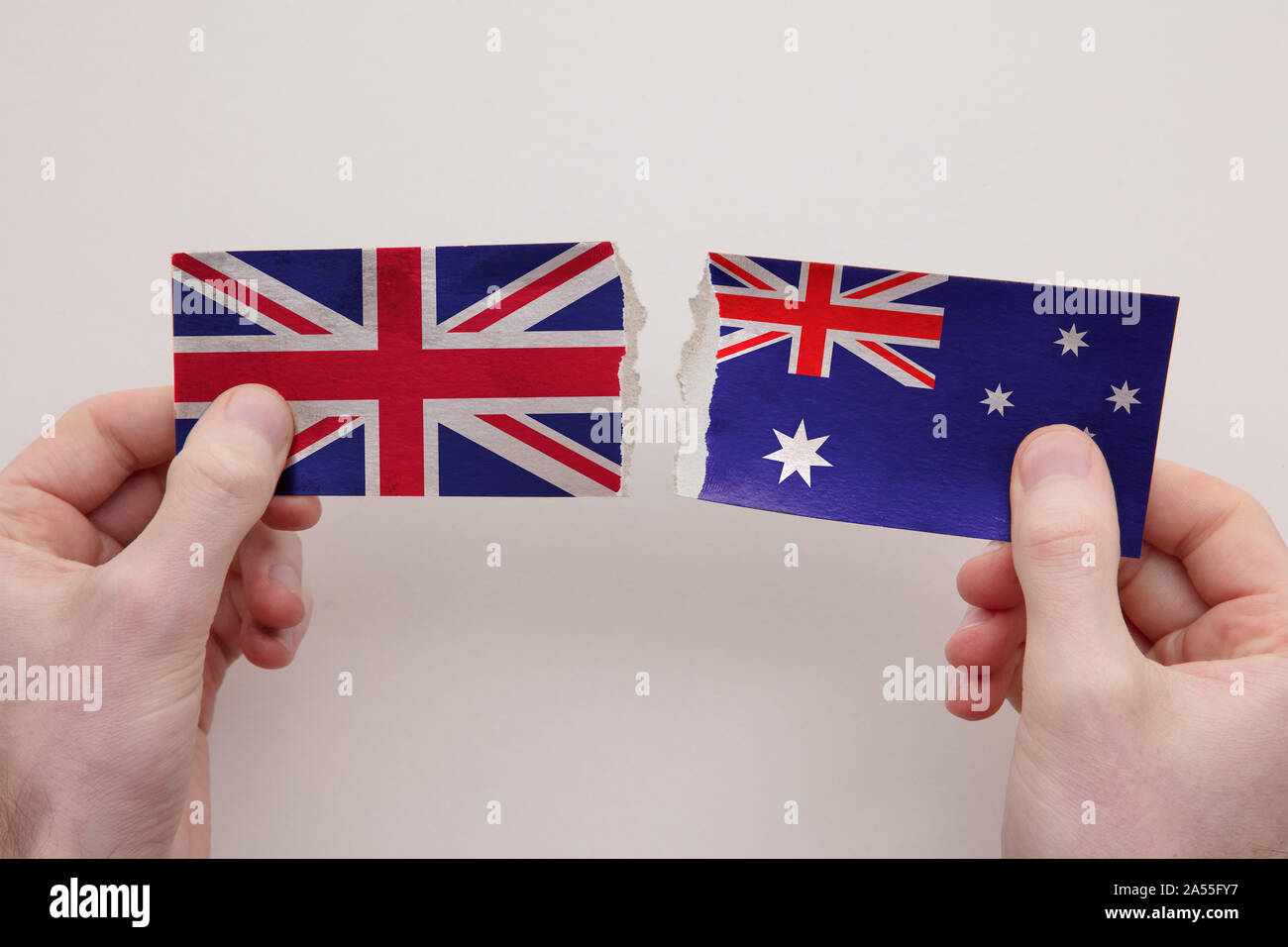 UK and Australia paper flags ripped apart. political relationship ...