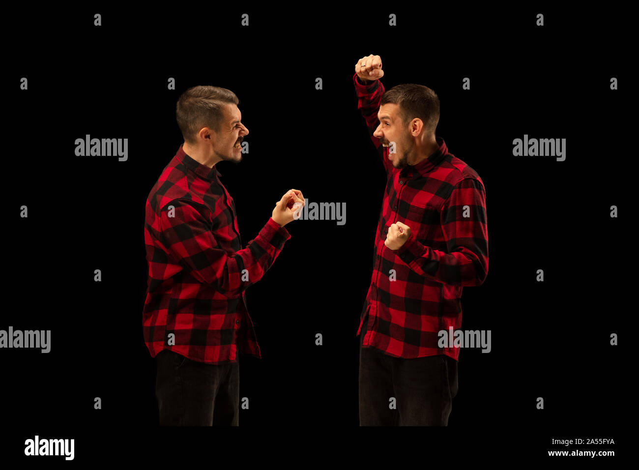 Young handsome man arguing with himself on black studio background ...