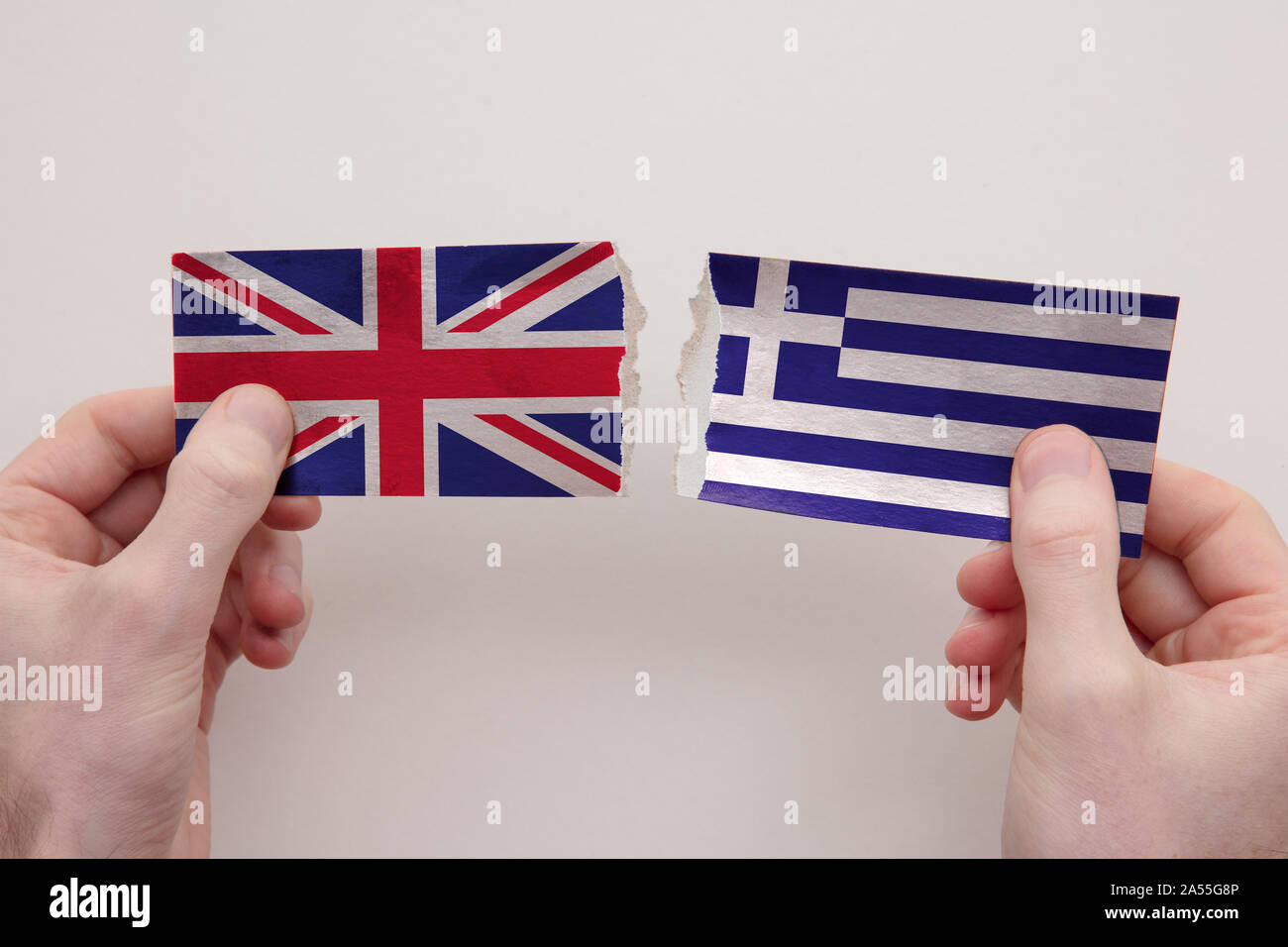 UK and Greece paper flags ripped apart. political relationship concept ...