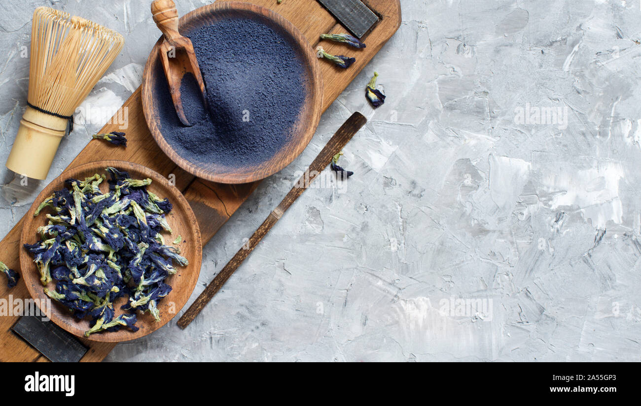 Butterfly pea blue matcha powder with wrisk and dried flowers Stock ...