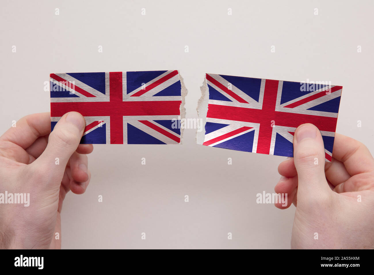 UK Union Jack paper flags ripped apart. political relationship concept ...