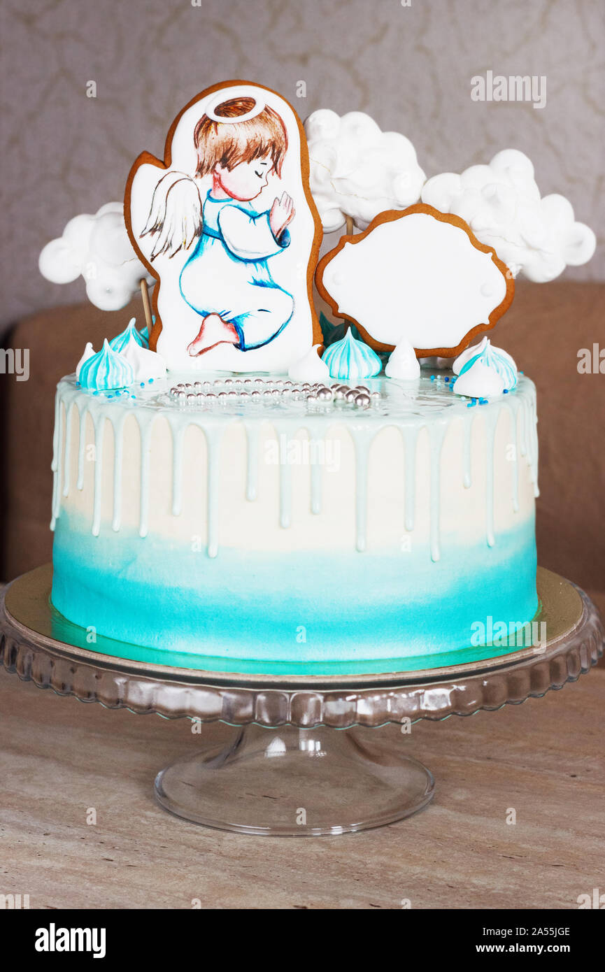 blue baptism cake with an angel on a gingerbread Stock Photo - Alamy