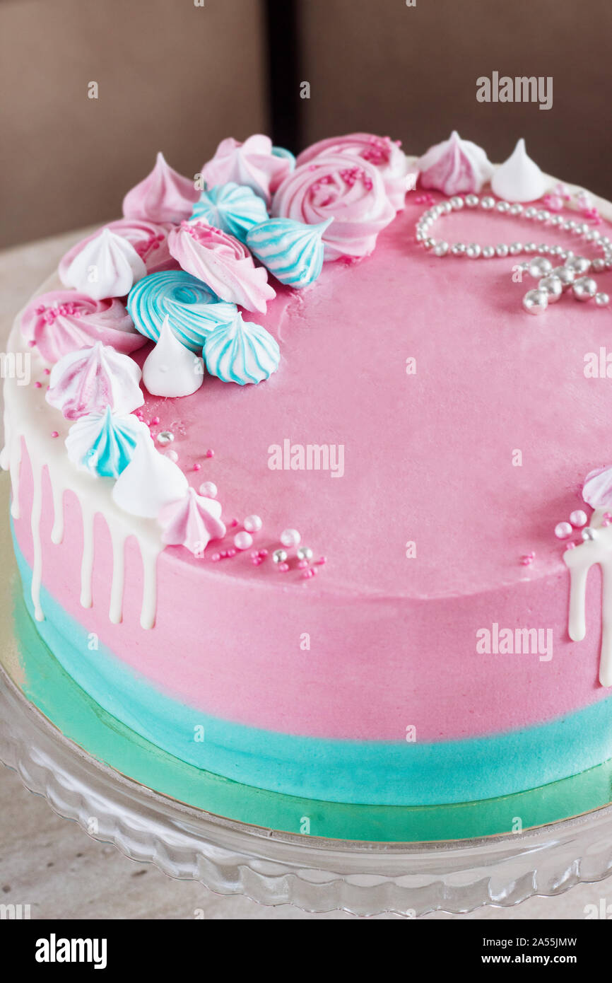 Pink cake for the baptism of a girl on a light background with ...