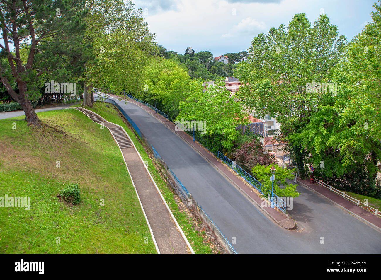 road and pedestrian path in the urban park Stock Photo - Alamy