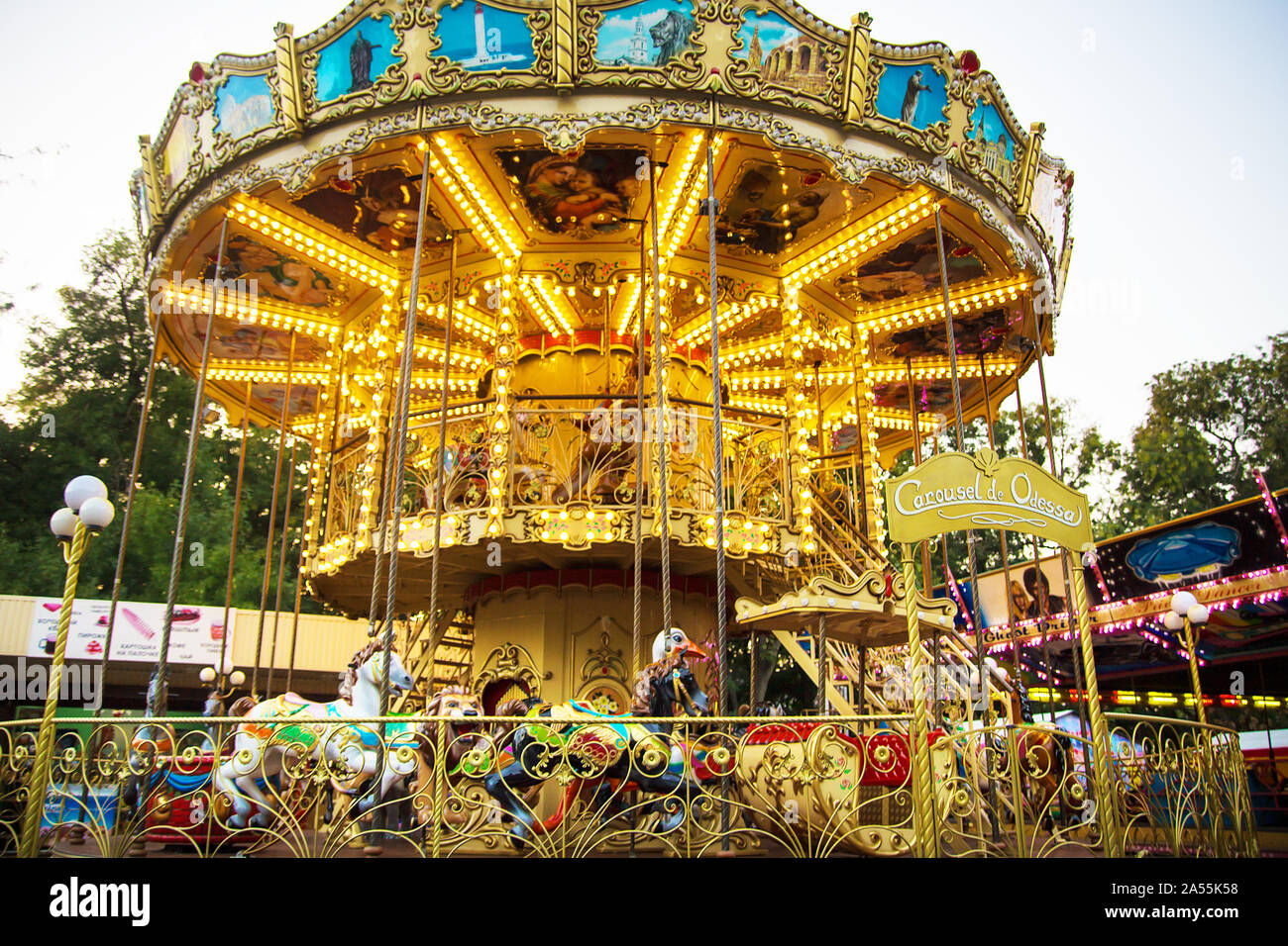beautiful carousel lights in different lights. Summer joy Stock Photo ...