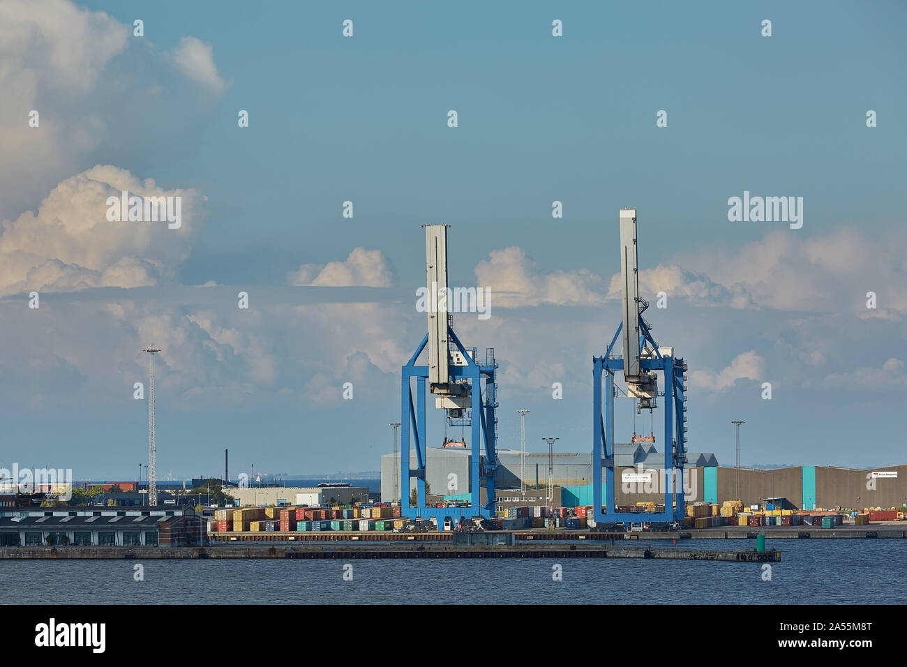 COPENHAGEN, DENMARK - SEPTEMBER 16, 2017: Port crane loads a container ...