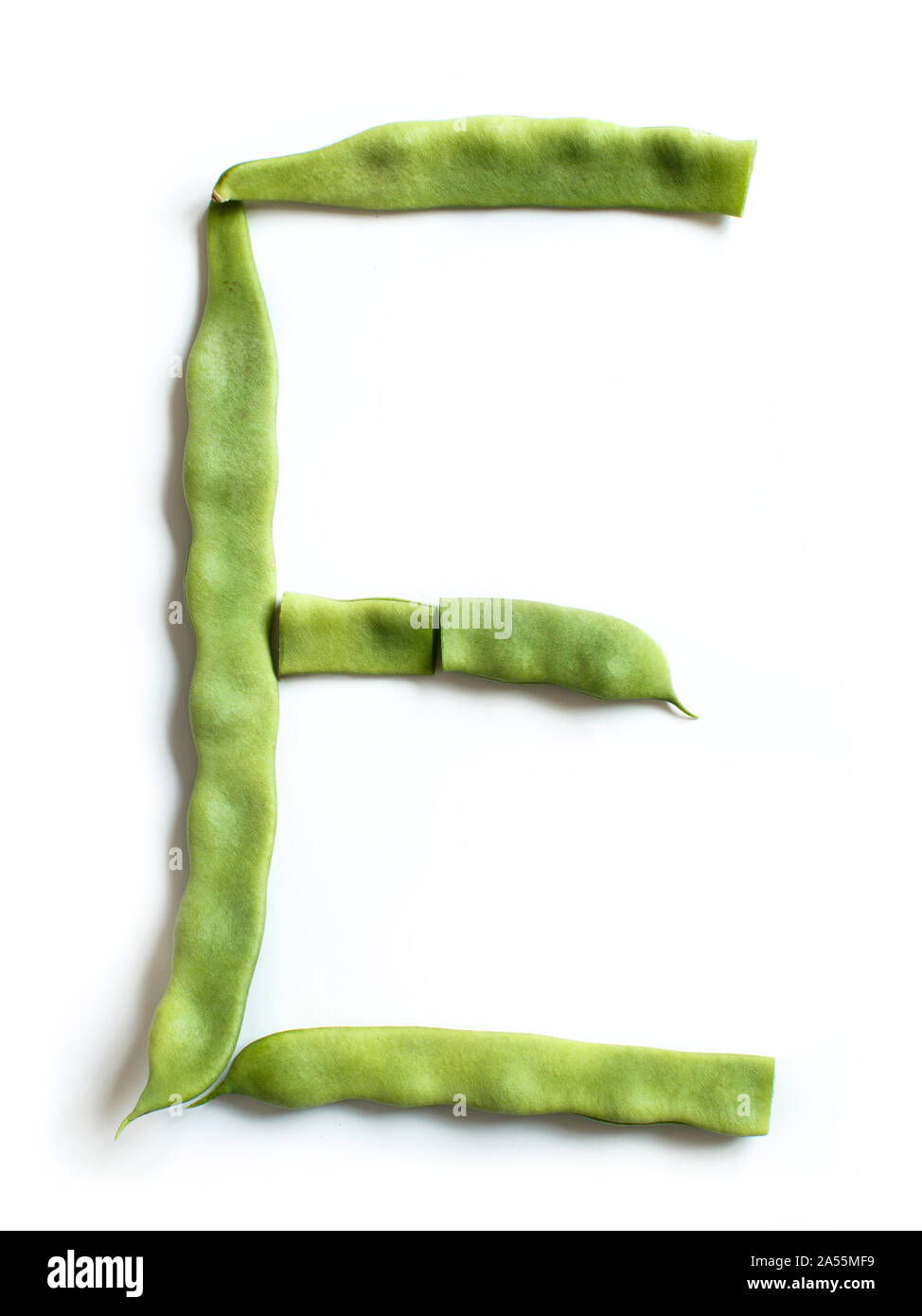 letter E made from Piattoni green beans top view isolated Stock Photo ...