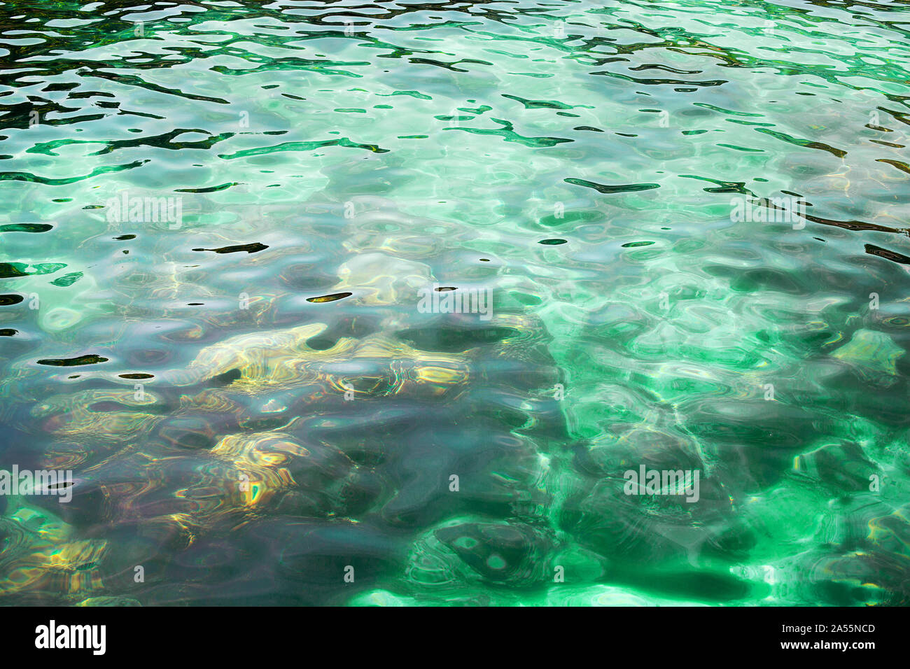 Blue crystal clear sea water, stones texture background, turquoise ...