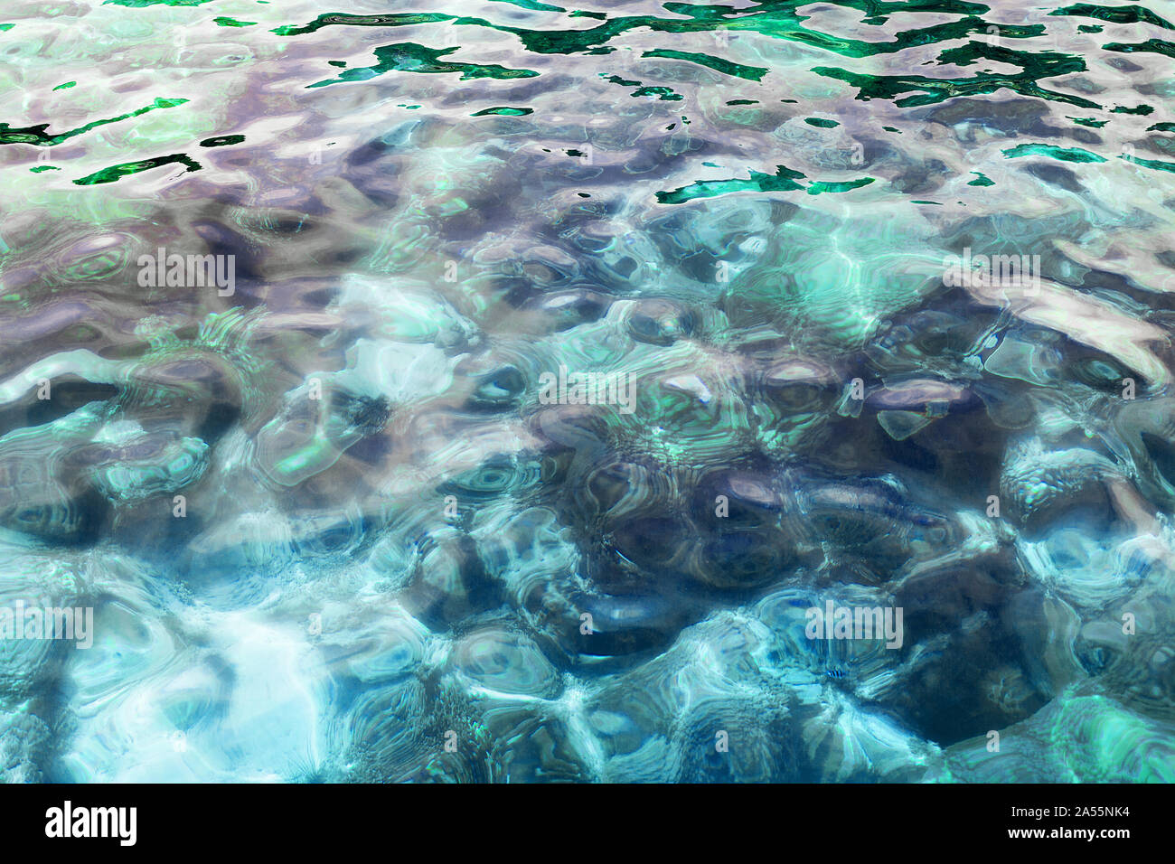 Blue crystal clear sea water, stones texture background, turquoise ...