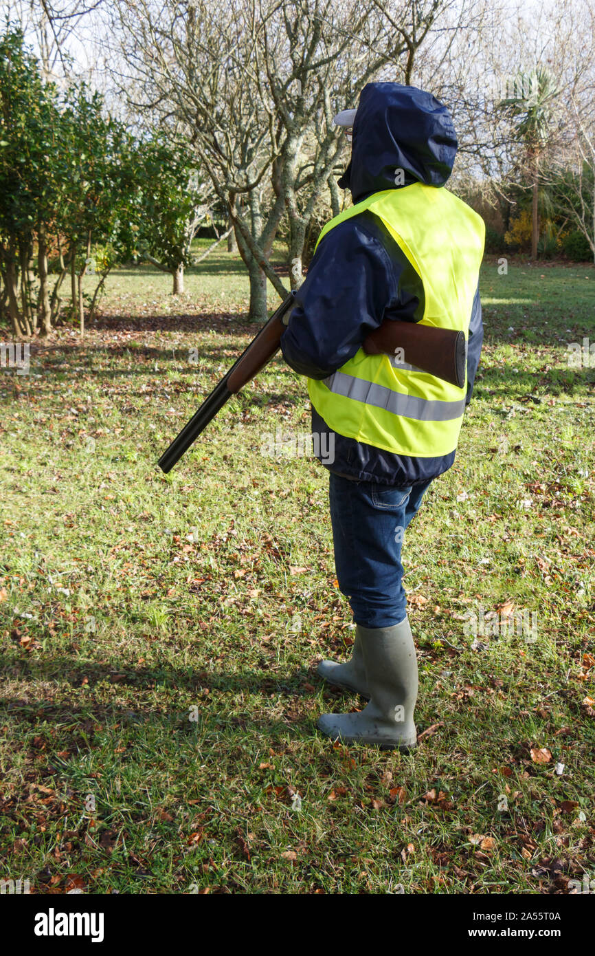 Hunter with its rifle under his arm during autumn Stock Photo - Alamy