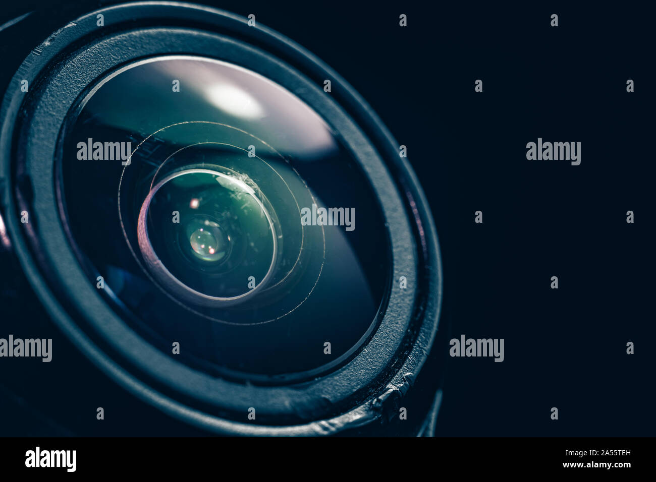 Close up dust and peel scratch on a camera lens smart phone background ...