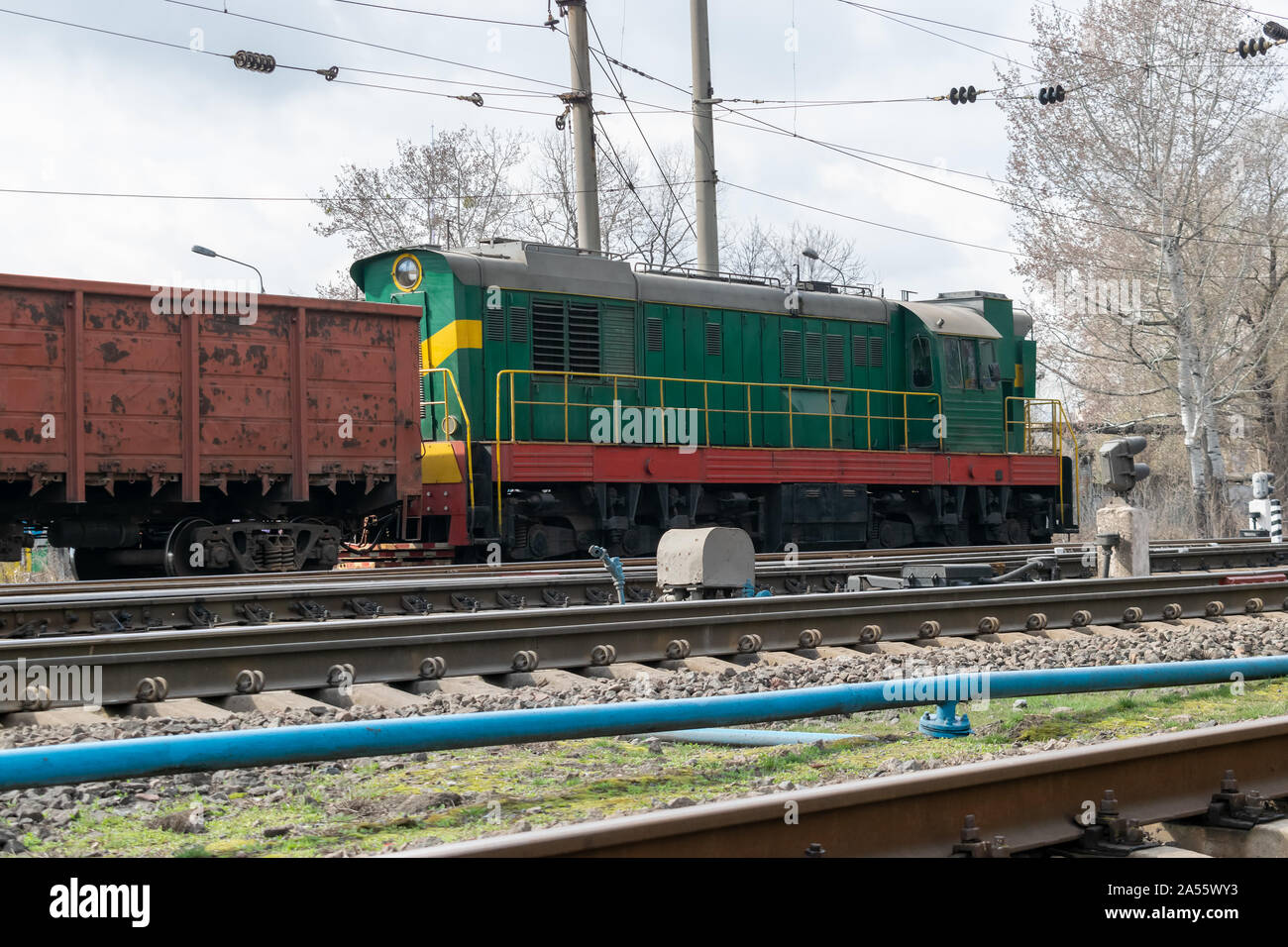 Diesel locomotive with cargo train on the track Stock Photo - Alamy