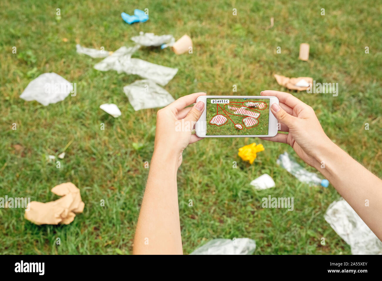 Waste Management. Young girl sitting a park holding smartphone using ...