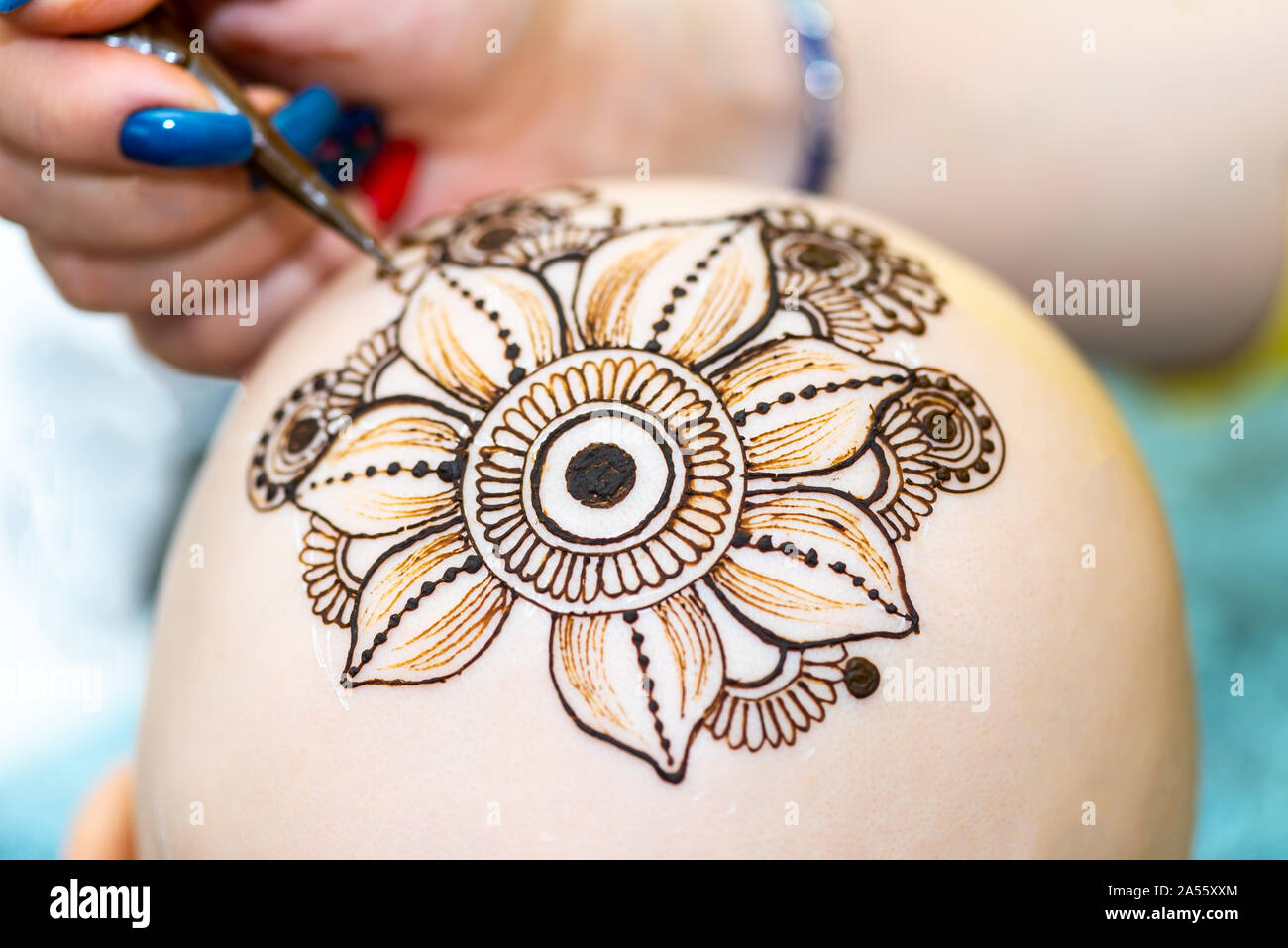 Drawing process of henna mehndi tattoo on womans bald head Stock Photo ...