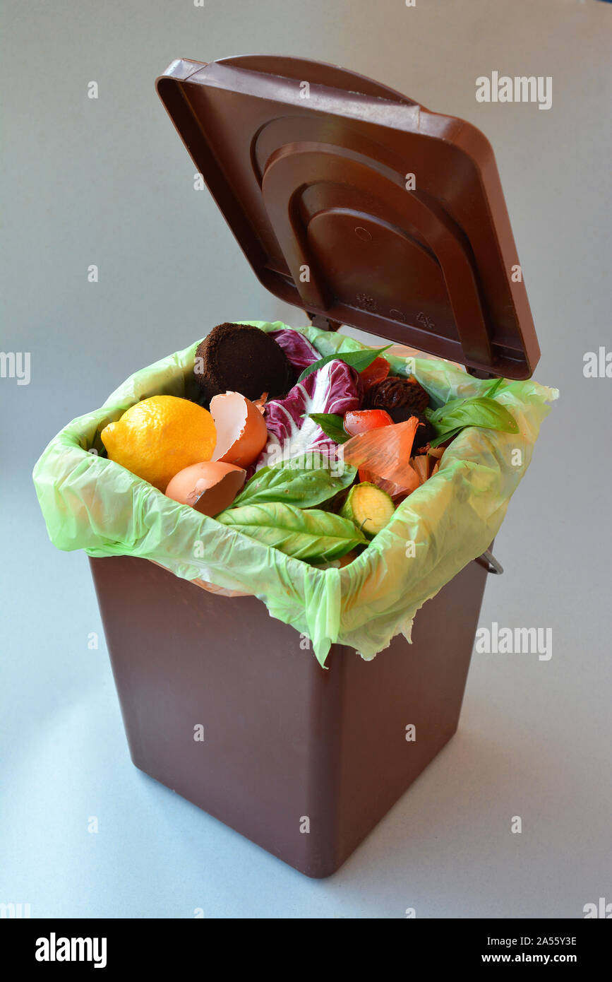 Trash bin full of organic garbage Stock Photo - Alamy
