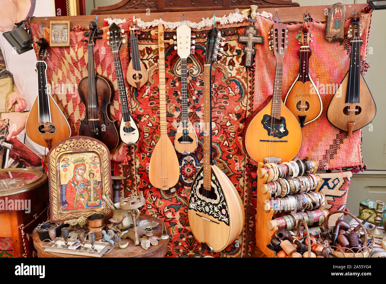 Greek bazoukis hanging on a wall Stock Photo - Alamy