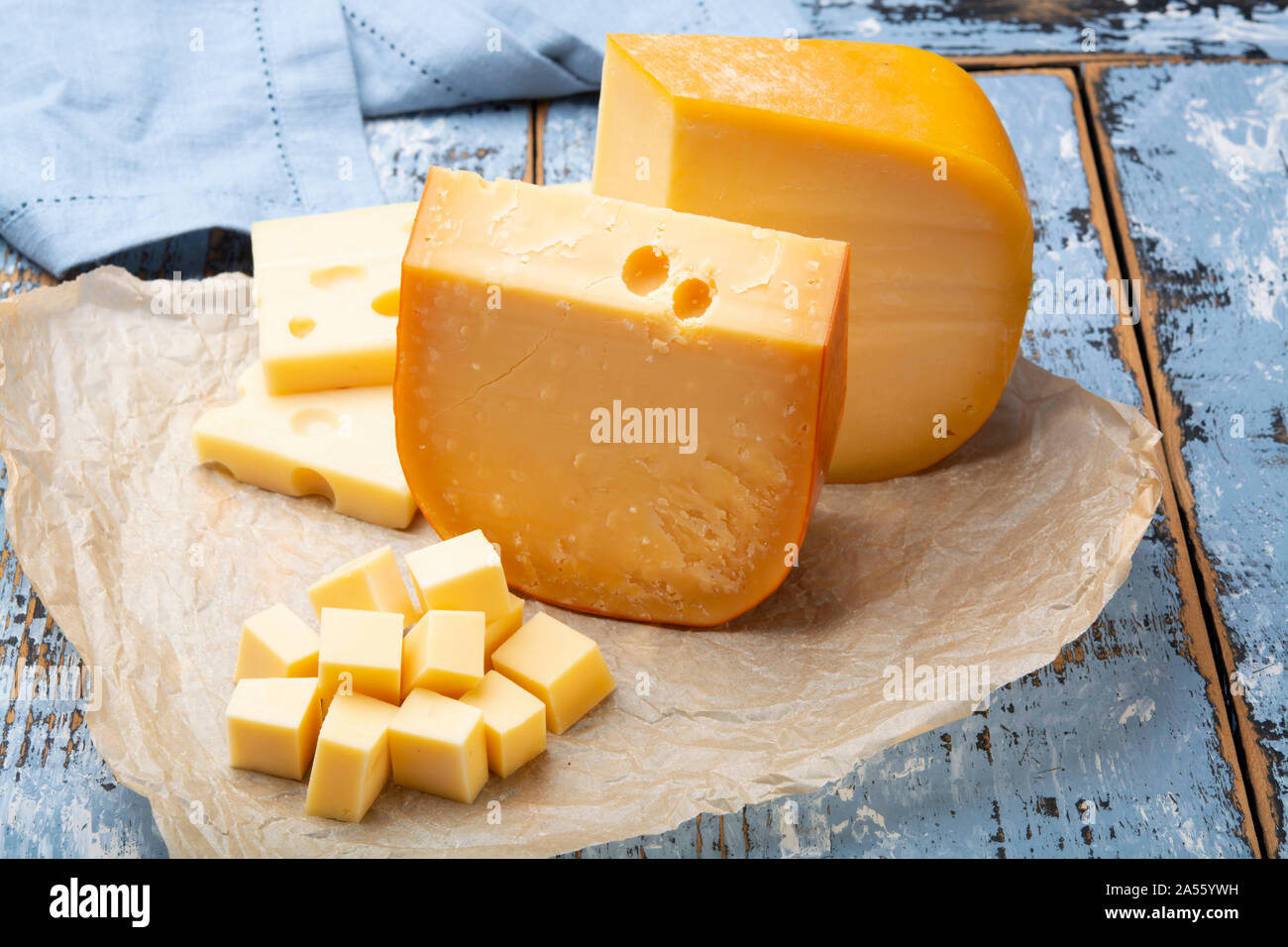 Famous hard cheeses, Dutch Gouda and French Emmentaler in pieces and ...