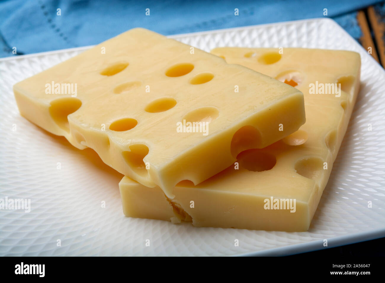 Two blocks of French emmental semi-hard cheese close up Stock Photo - Alamy