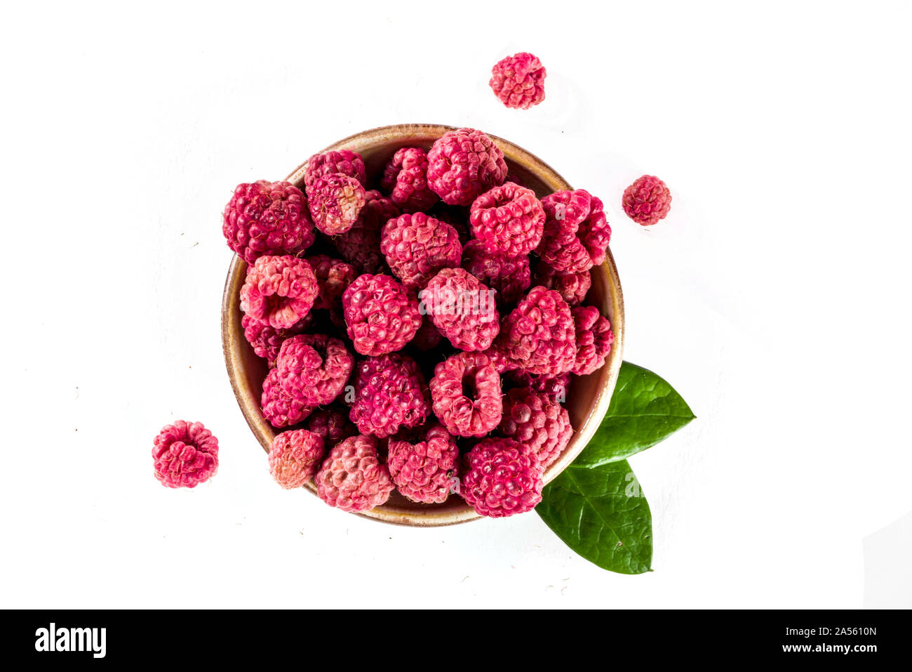 Heap of sun dried raspberries isolated on white background. Top view ...