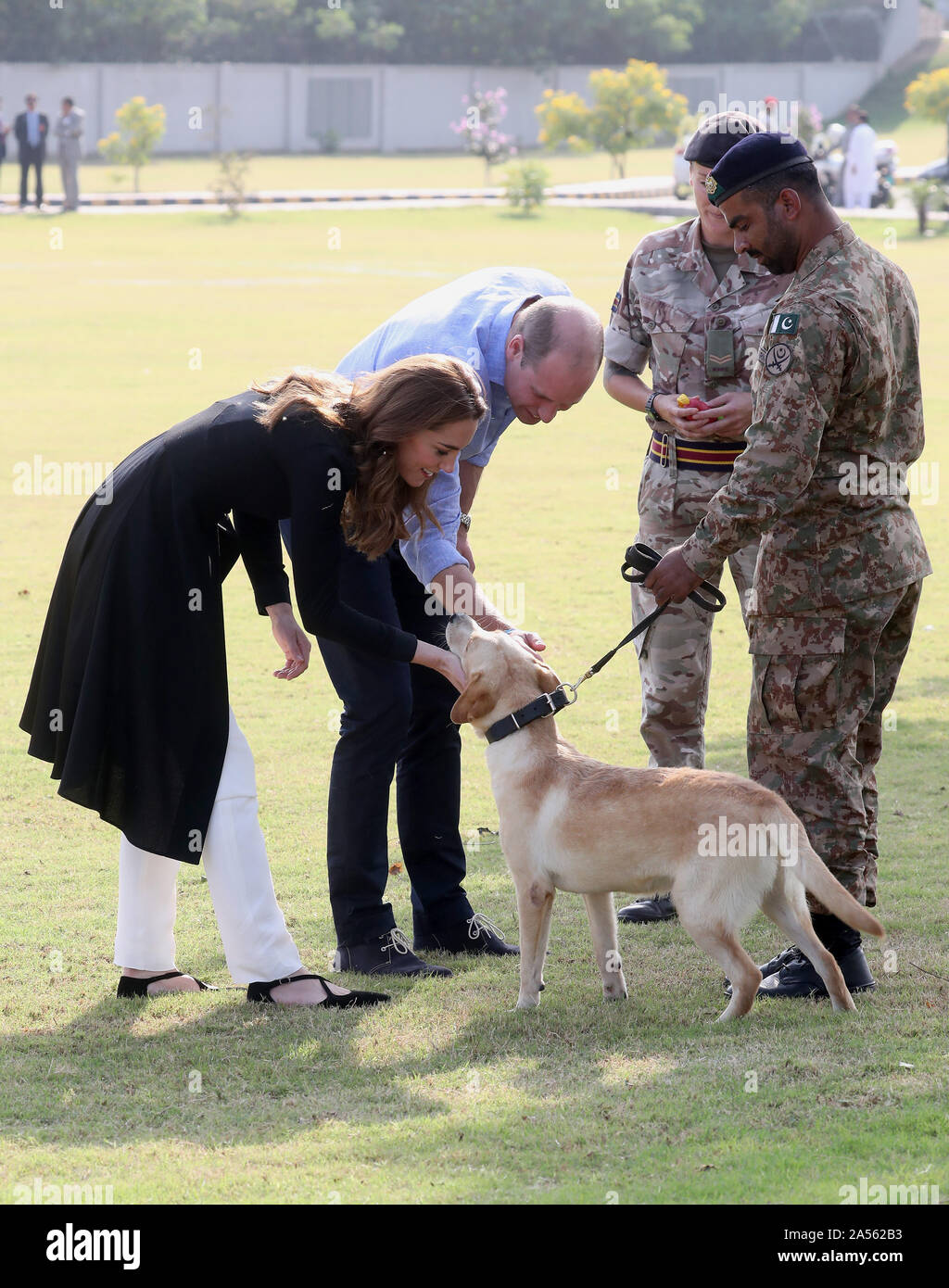 The Duke and Duchess of Cambridge with golden labrador Polka during a ...
